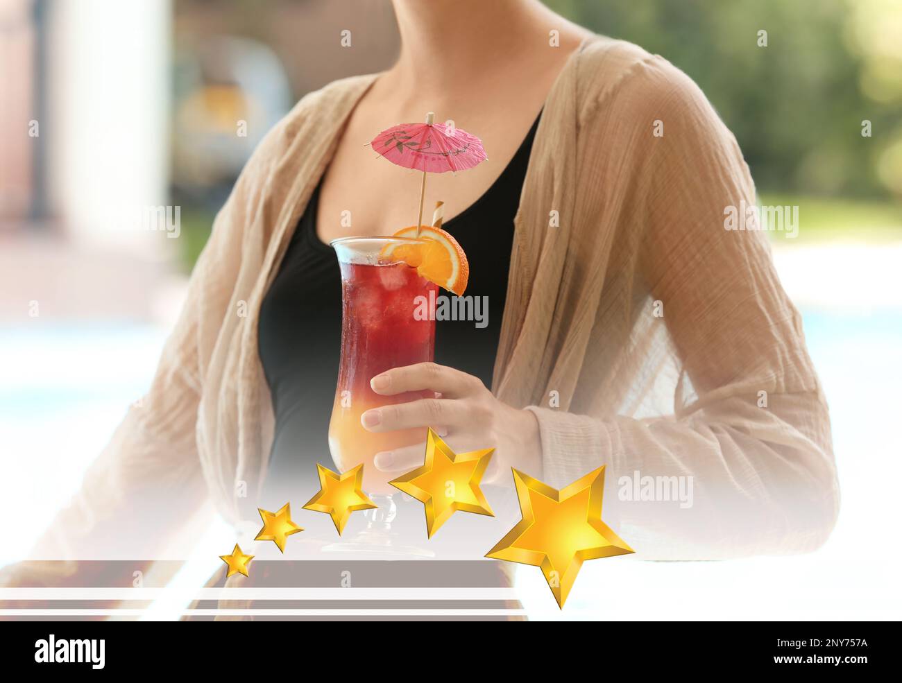 Woman holding glass with delicious cocktail at five star hotel Stock ...