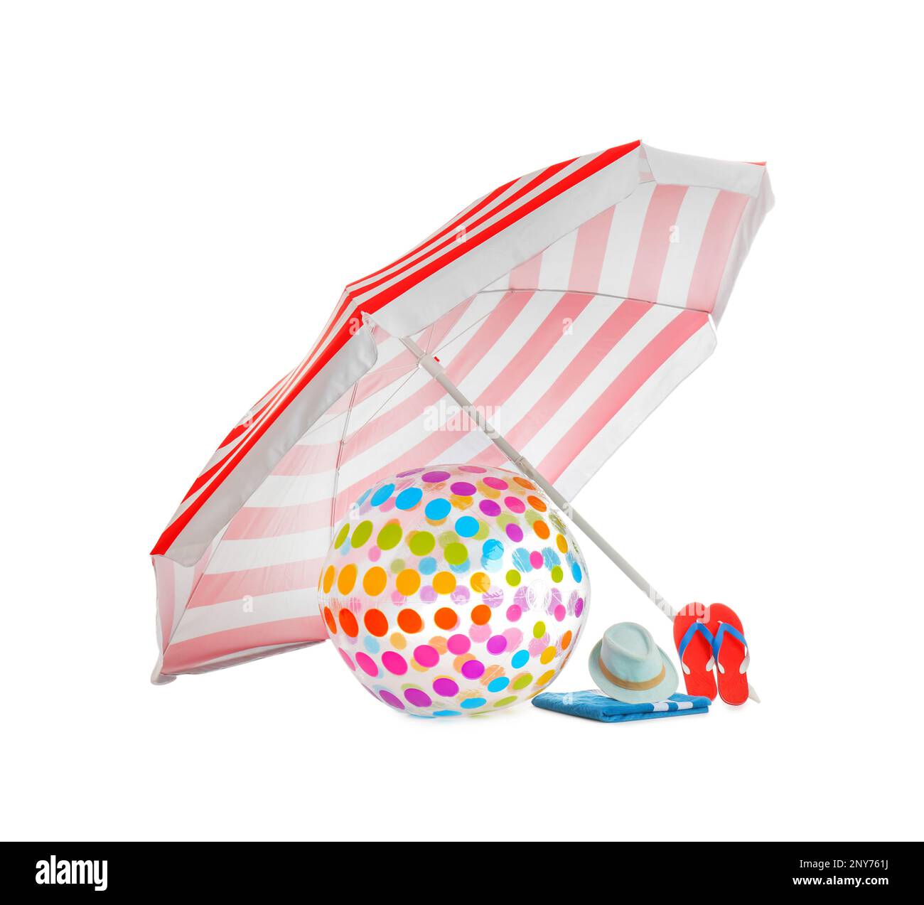Open striped beach umbrella, inflatable ball and accessories on white ...