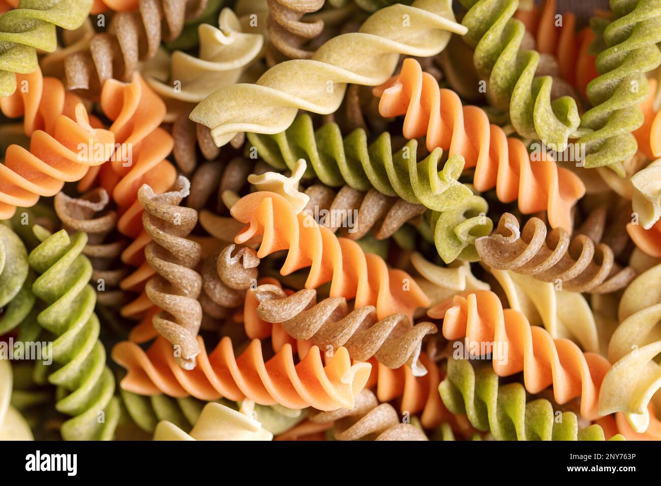 A variety of fusilli pasta made from different types of legumes, green ...