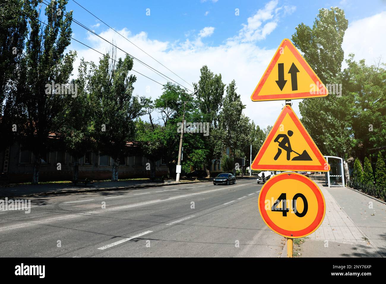 Traffic signs on city street, space for text. Road repair Stock Photo ...