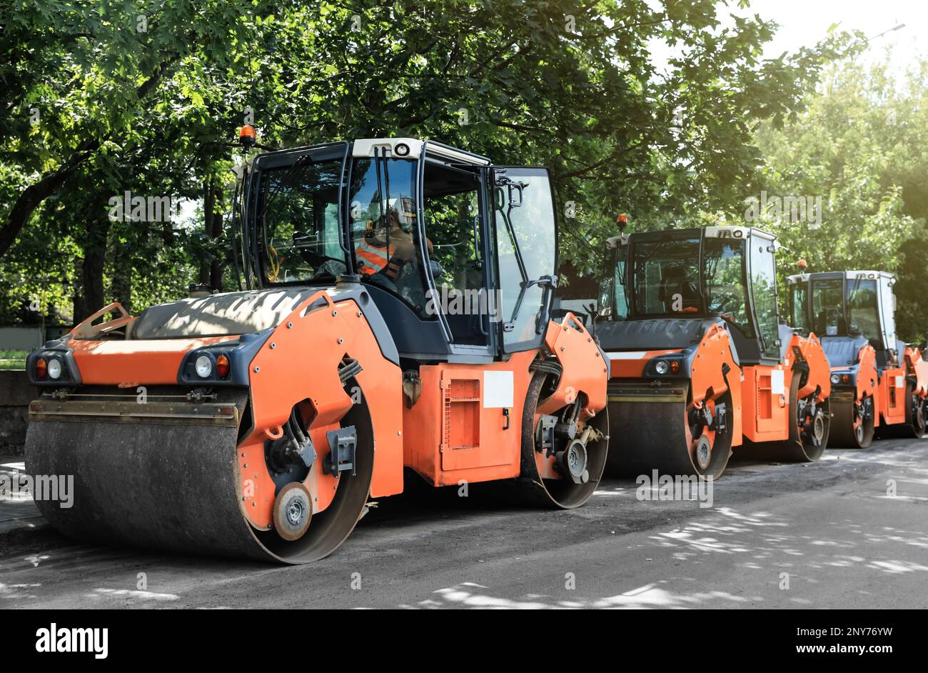 Modern rollers on city street. Road repair service Stock Photo - Alamy