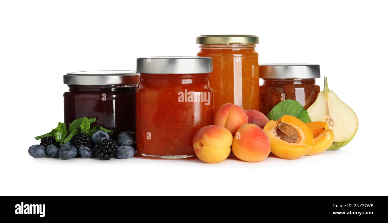 Jars with different jams and fresh fruits on white background Stock ...