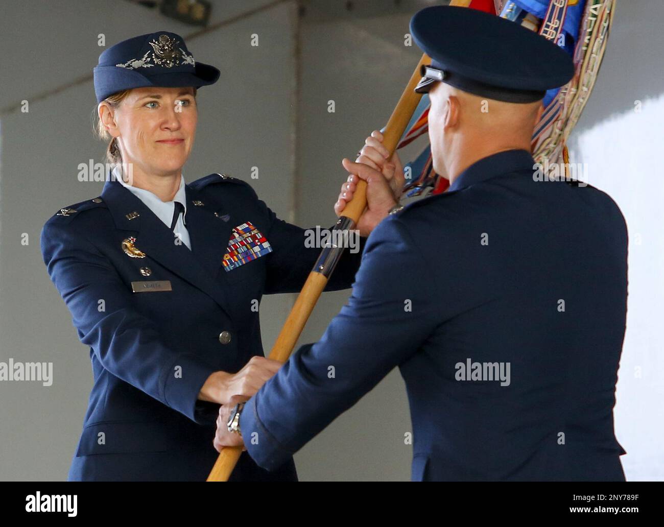 Col. Lisa Nemeth passes the guidon to Lt. Col. Ricardo Lopez during the ...