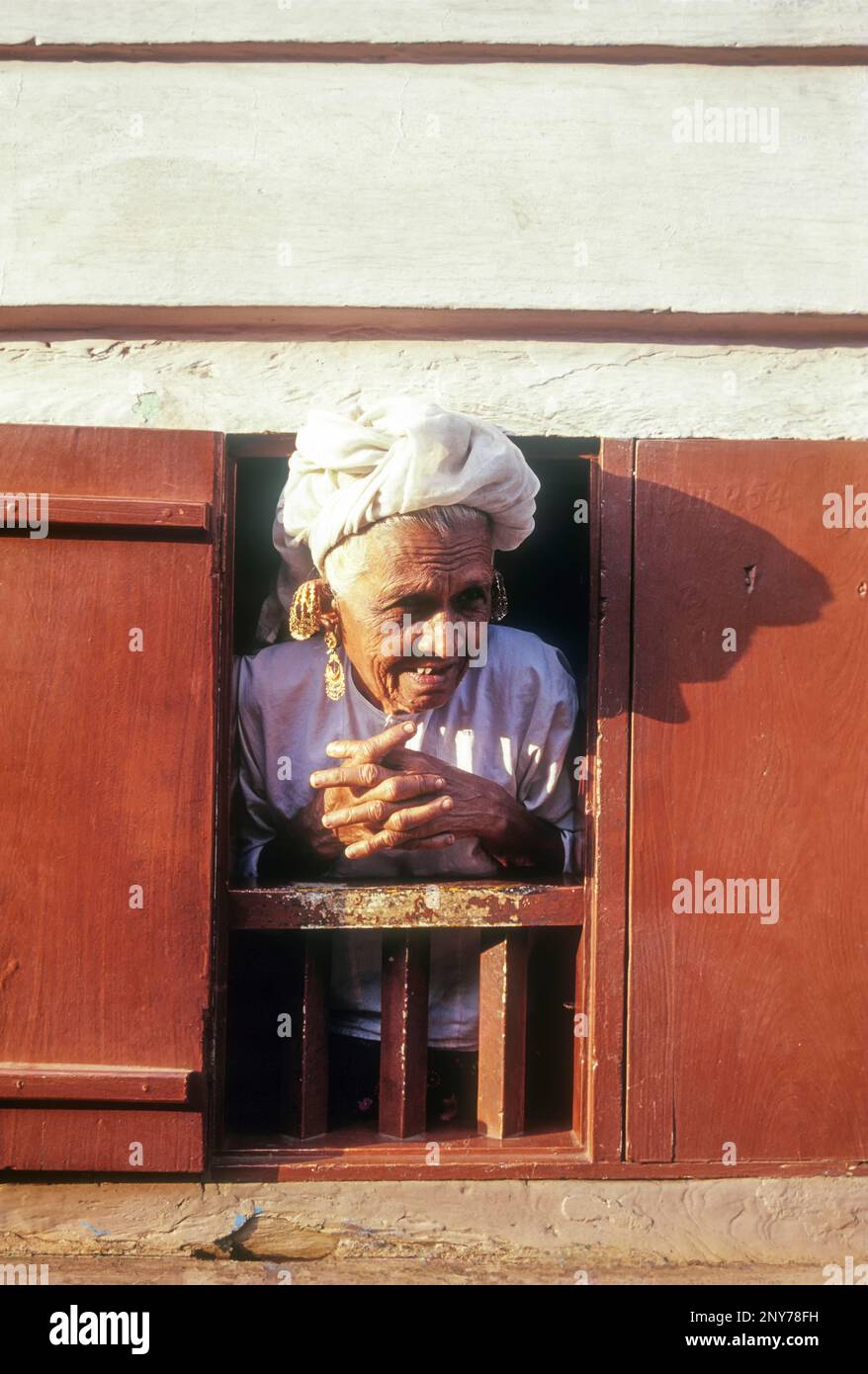 An old Moplah, Mopla muslim old lady looking through the window ...