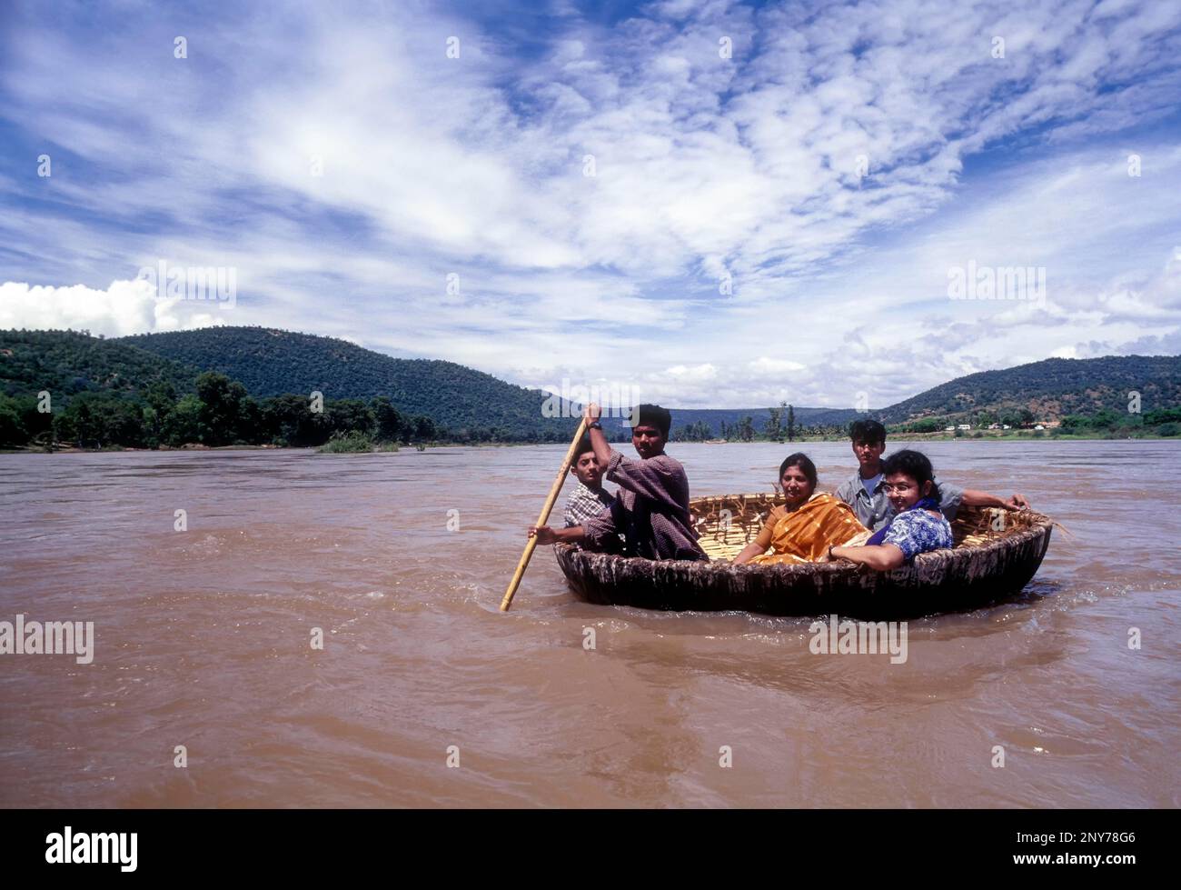 Tourists enjoying coracle ride in River Cauvery, Kaveri at Hogenakkal ...