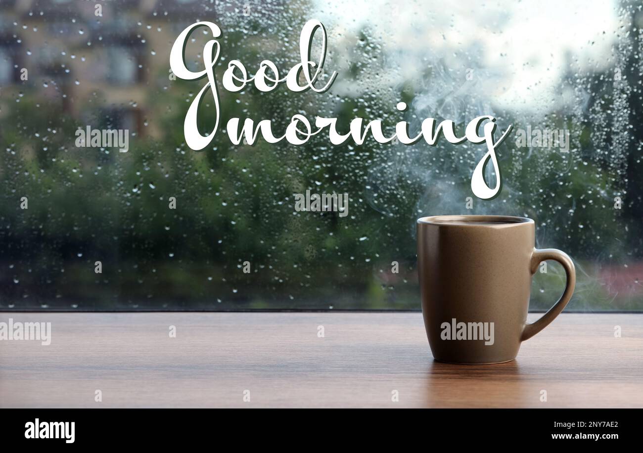 Cup of hot drink near window on rainy day. Good morning Stock Photo - Alamy