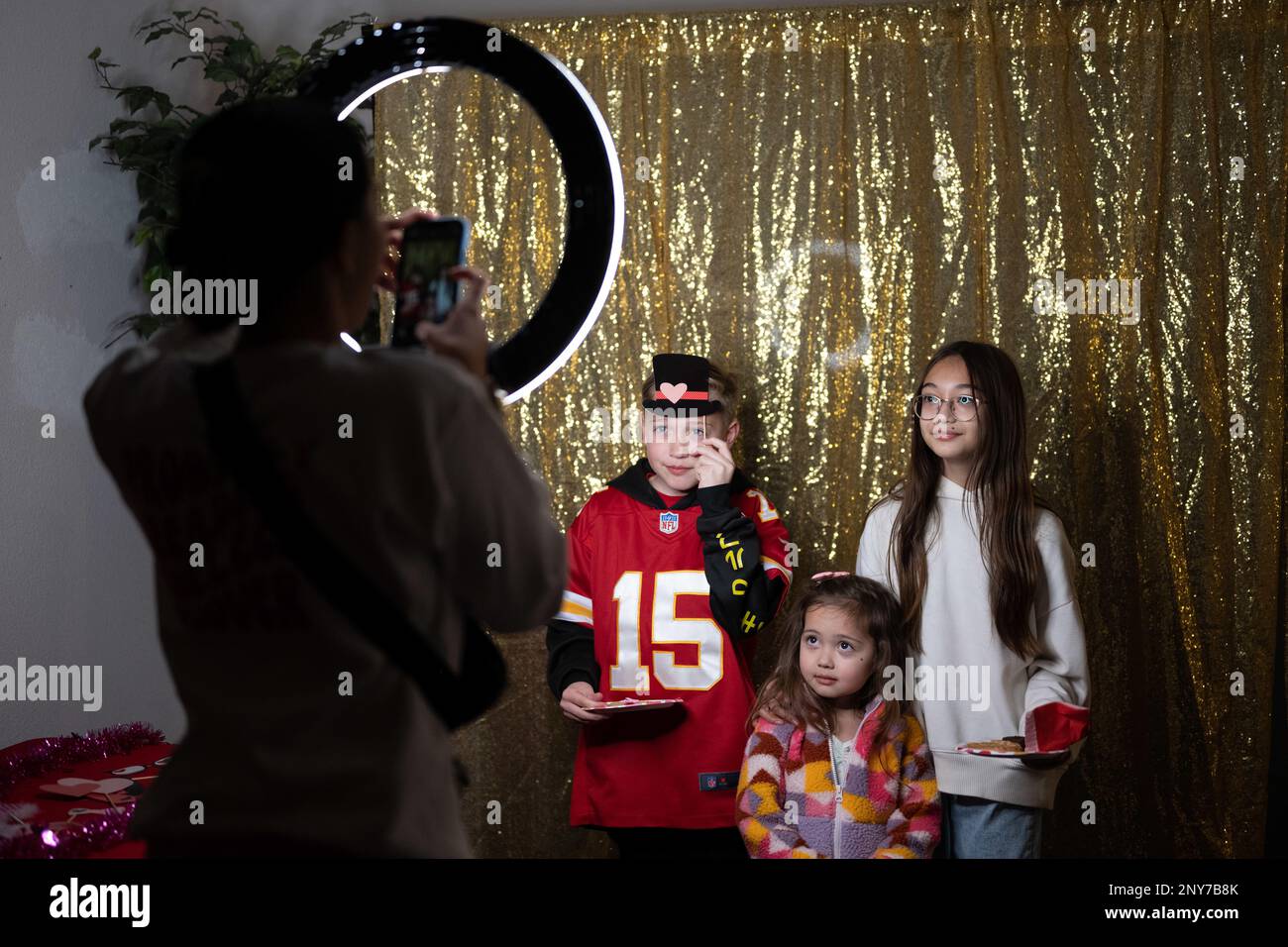 An Exceptional Family Member Program family uses a photo booth during a ...