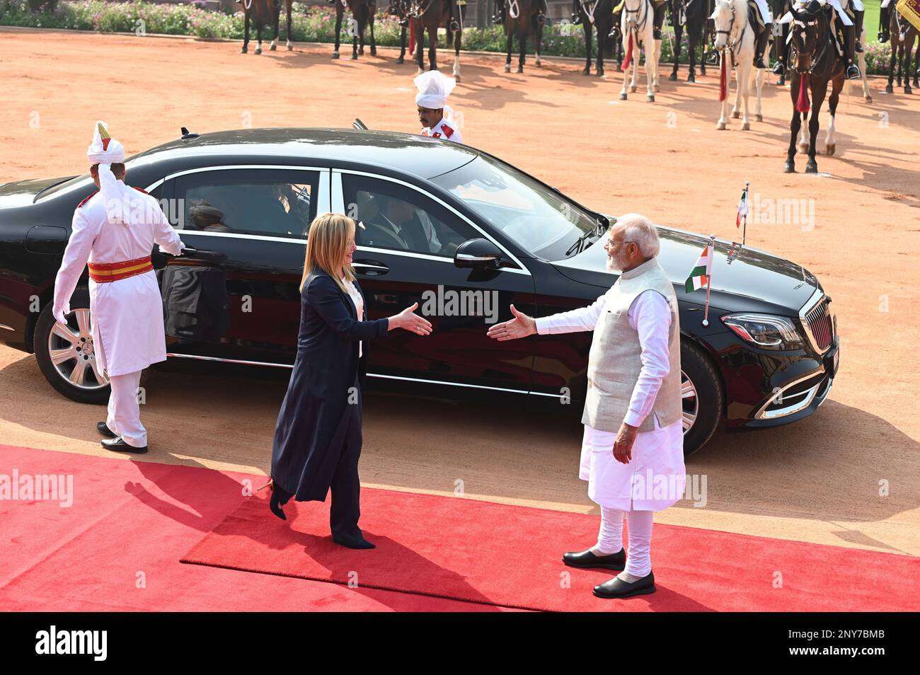 Italian Premier Giorgia Meloni, left, is received by Indian Prime Minister Narendra Modi, as she ...