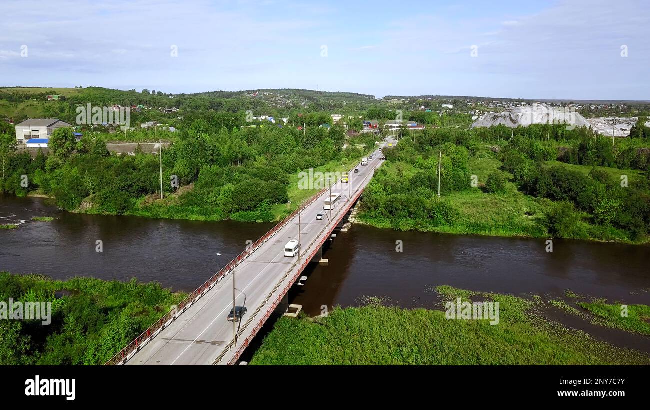 Aerial top down view of small road bridge across the river in rural ...