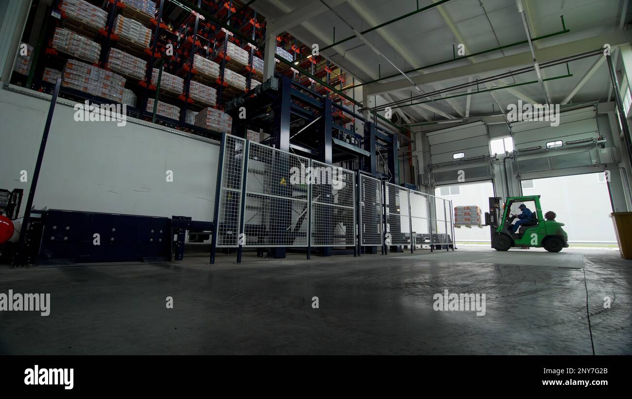 Logistics team working in an automated warehouse hi-res stock ...