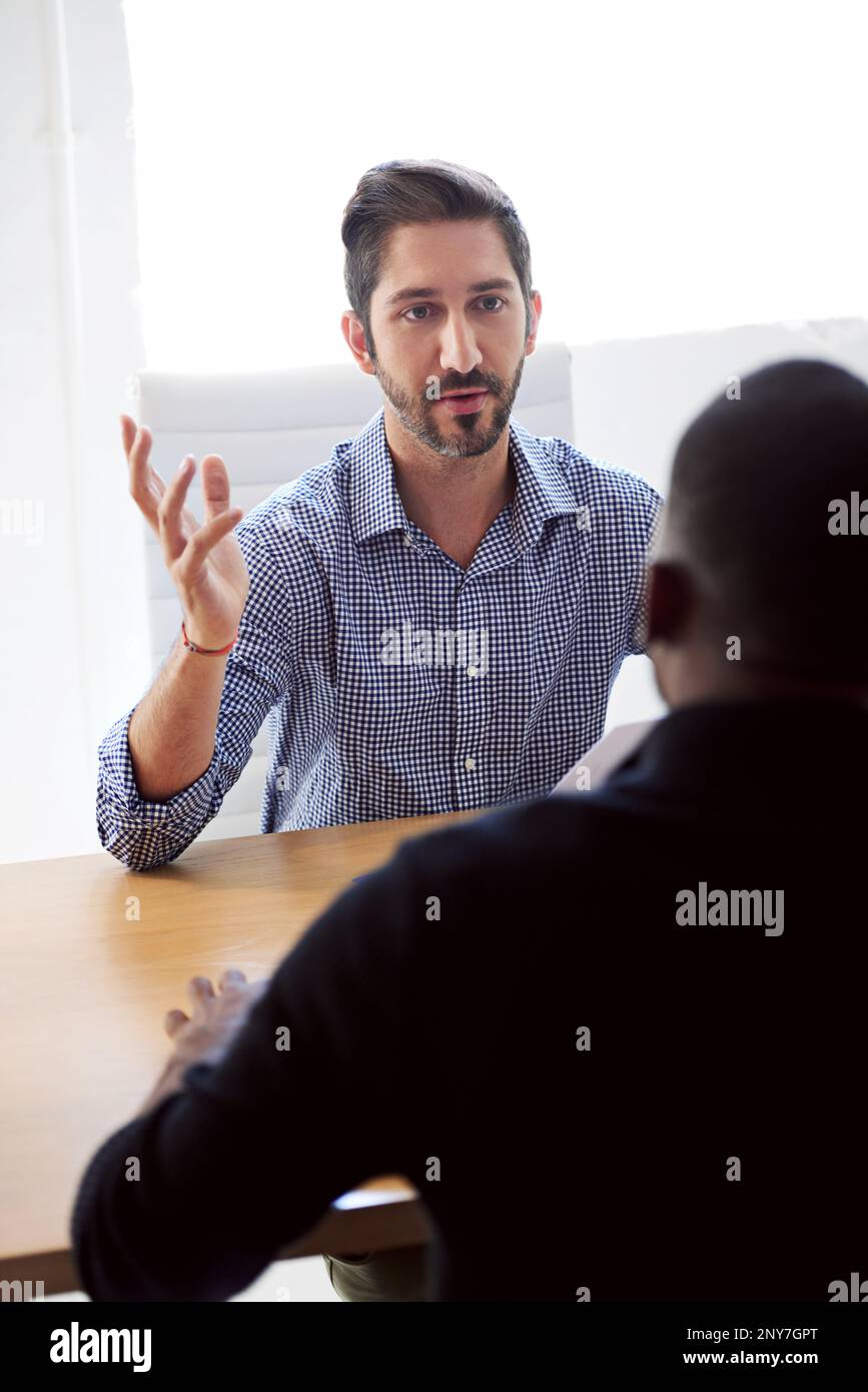 Tell me about your previous work experience. a businessman interviewing ...