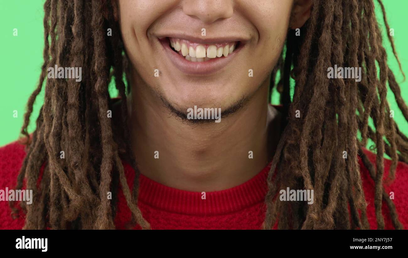 Laughing, smile and mouth of a man for a joke on a green screen ...