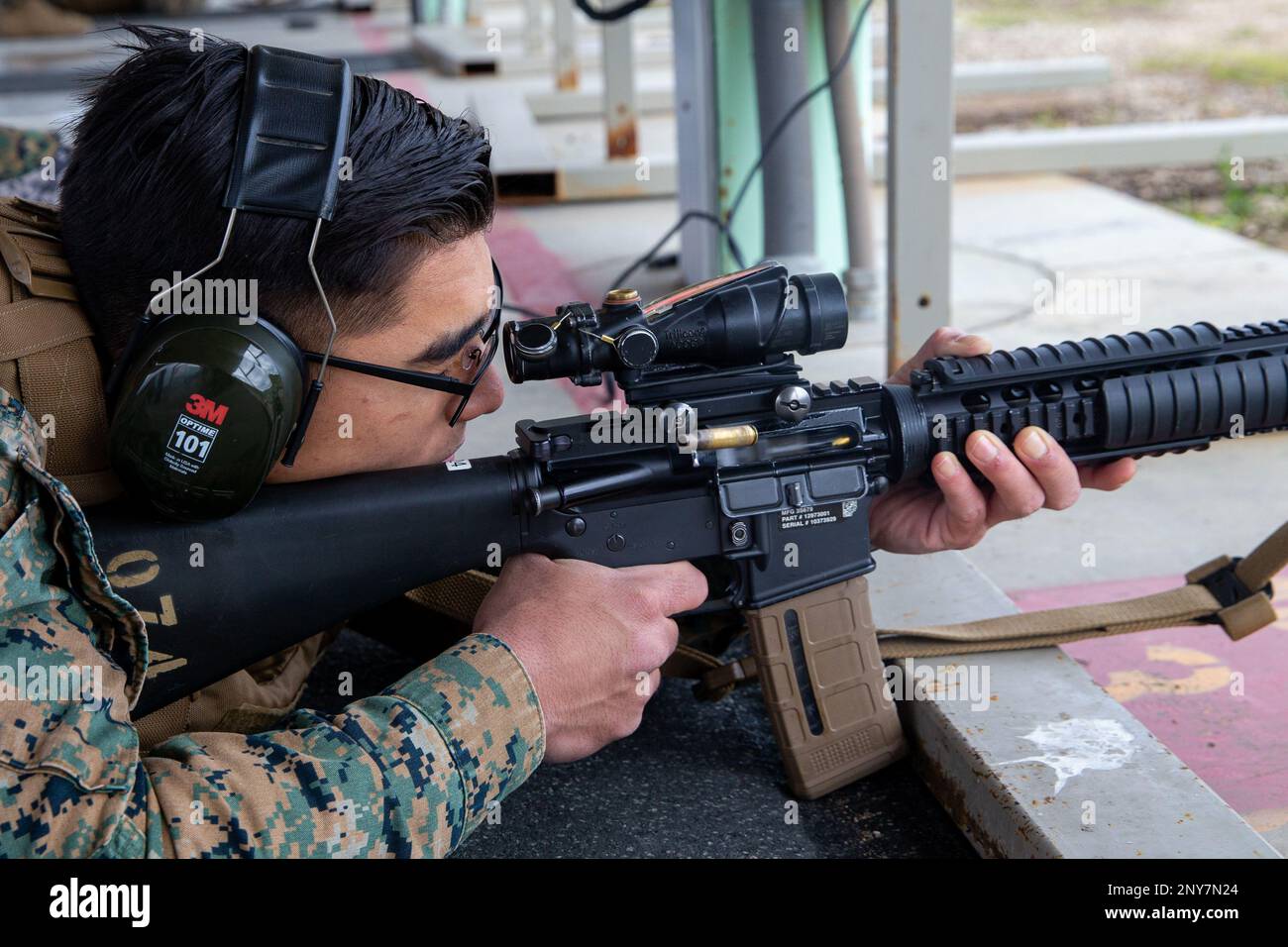 U.S. Marine Corps Lance Cpl. Gabriel Oreaiglesias fires an M-16A4 ...