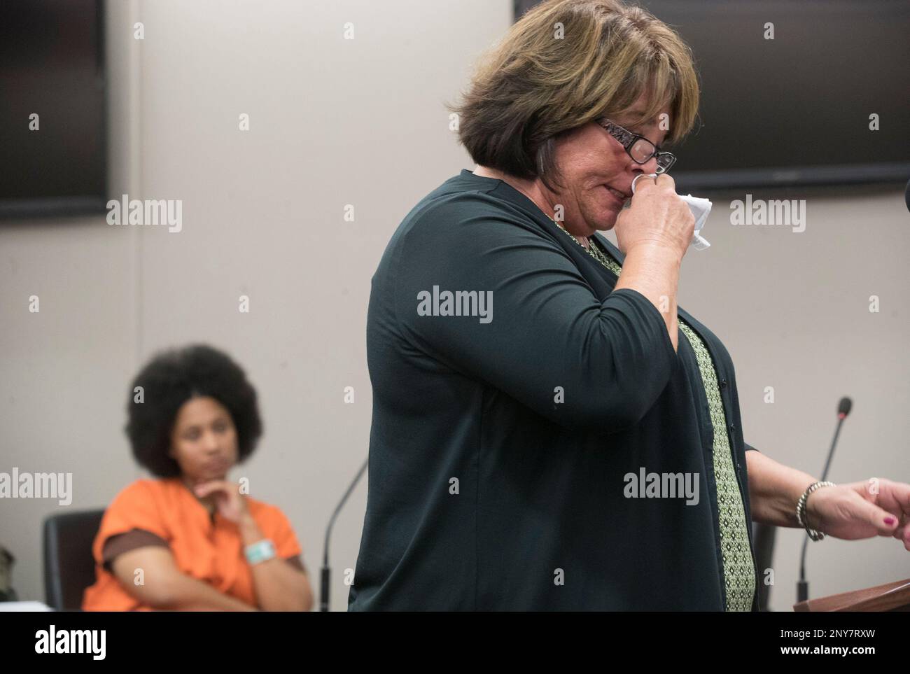 Colleen Ronnei, right, reads a victim impact statement about her son ...