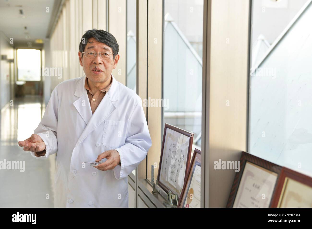 Professor Tsutomu Miyasaka speaks during an interview at Toin ...