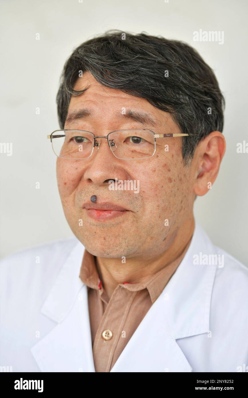 Professor Tsutomu Miyasaka speaks during an interview at Toin ...