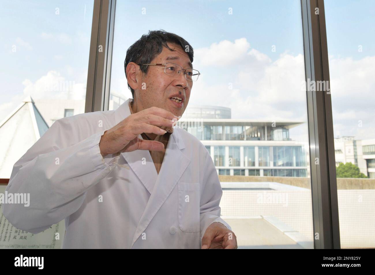 Professor Tsutomu Miyasaka speaks during an interview at Toin ...