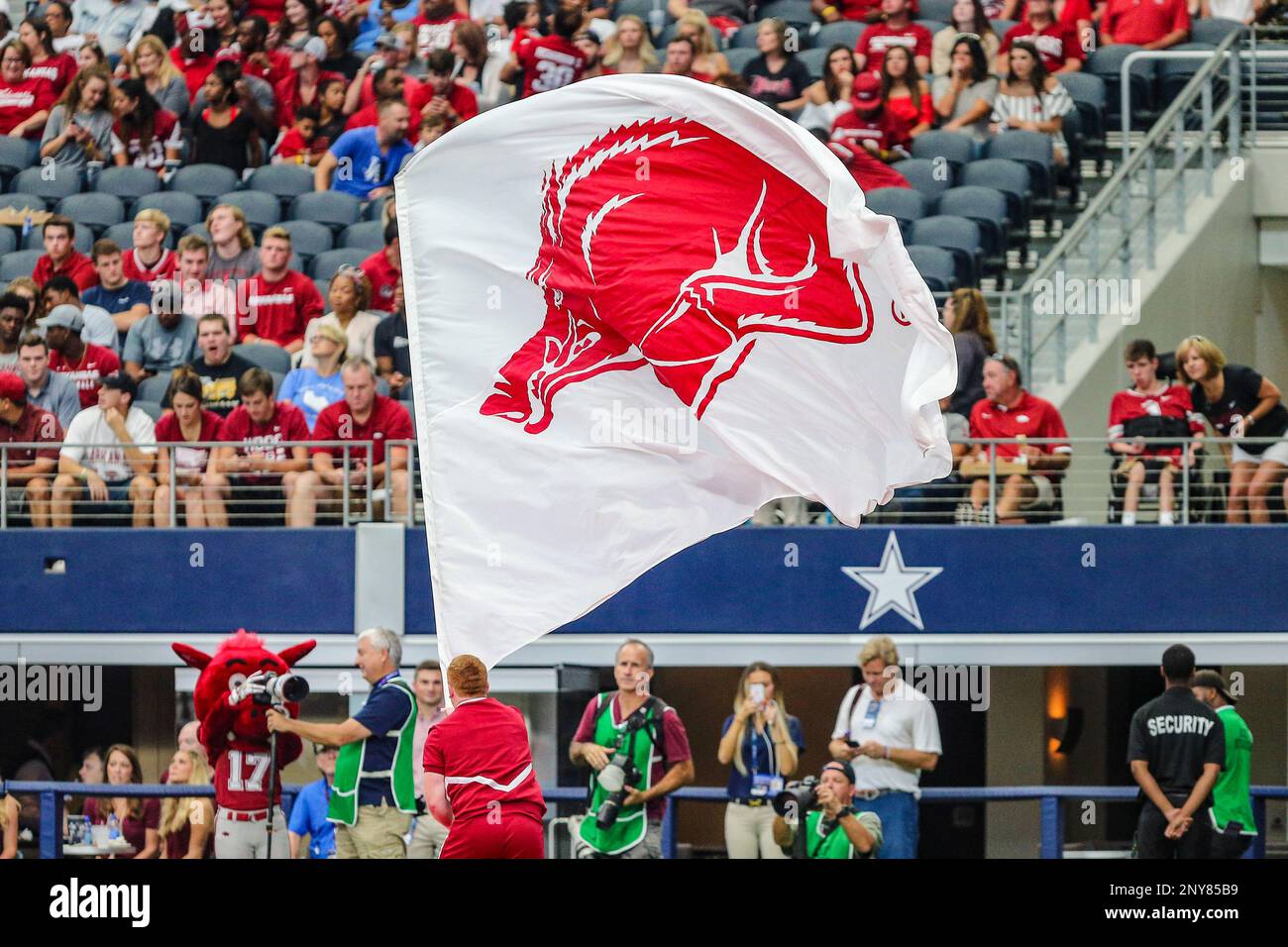 ARLINGTON, TX - SEPTEMBER 23: A member of the Arkansas Razorbacks flag ...