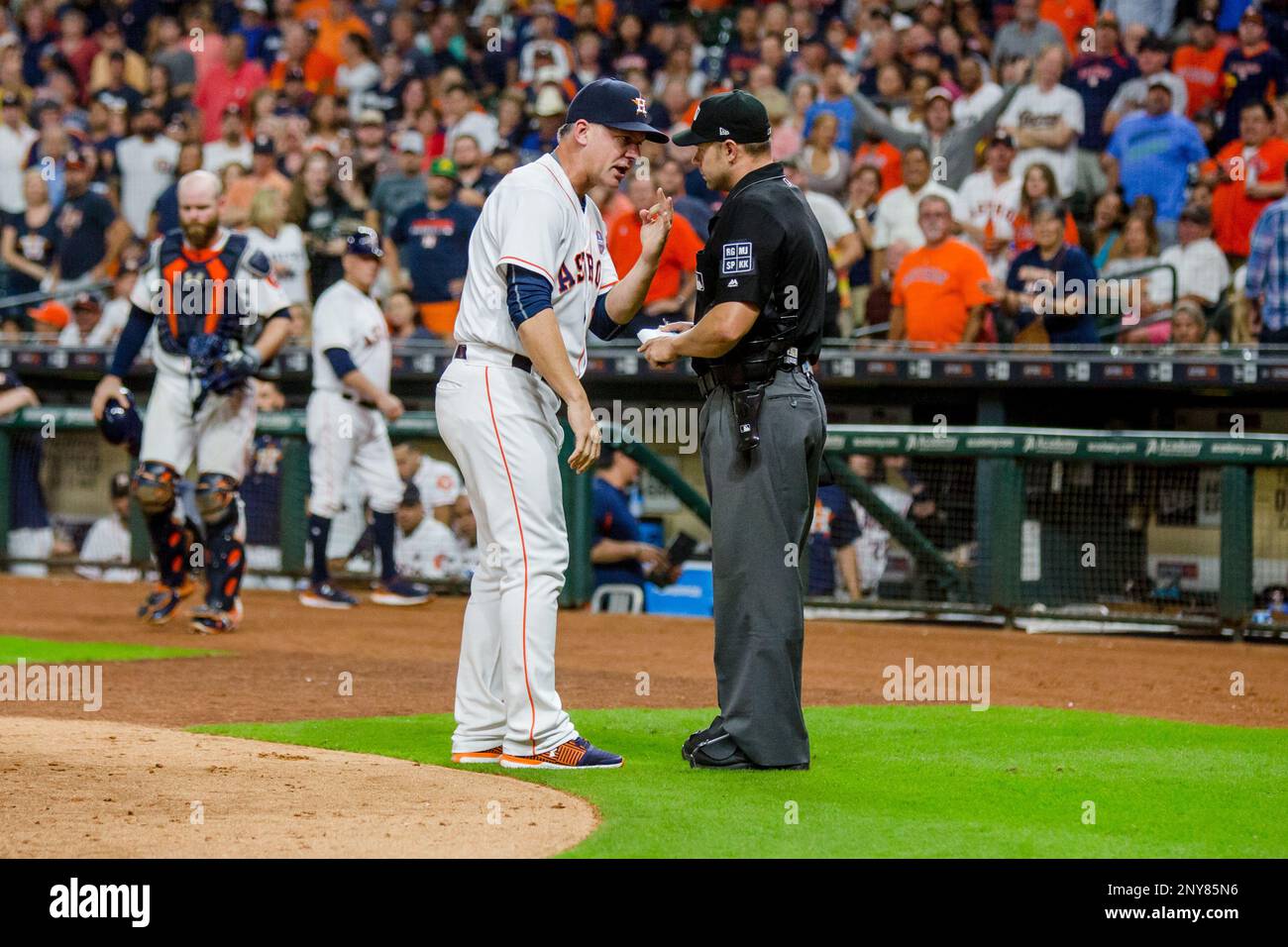 HOUSTON, TX - SEPTEMBER 24: Houston Astros manager A.J. Hinch (14) argues with home plate umpire ...