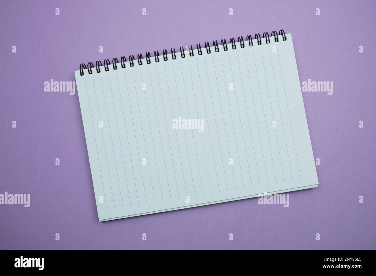 Mockup of Empty notebook page for copy on purple background Stock Photo ...