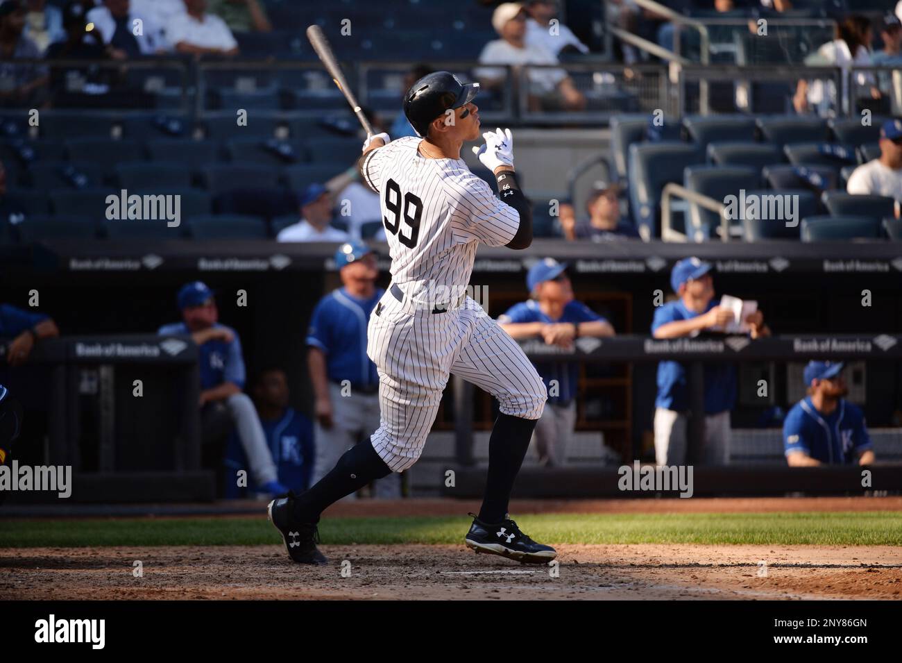 New York Yankees outfielder Aaron Judge (99) hits his 50th home run of the season to break Mark ...