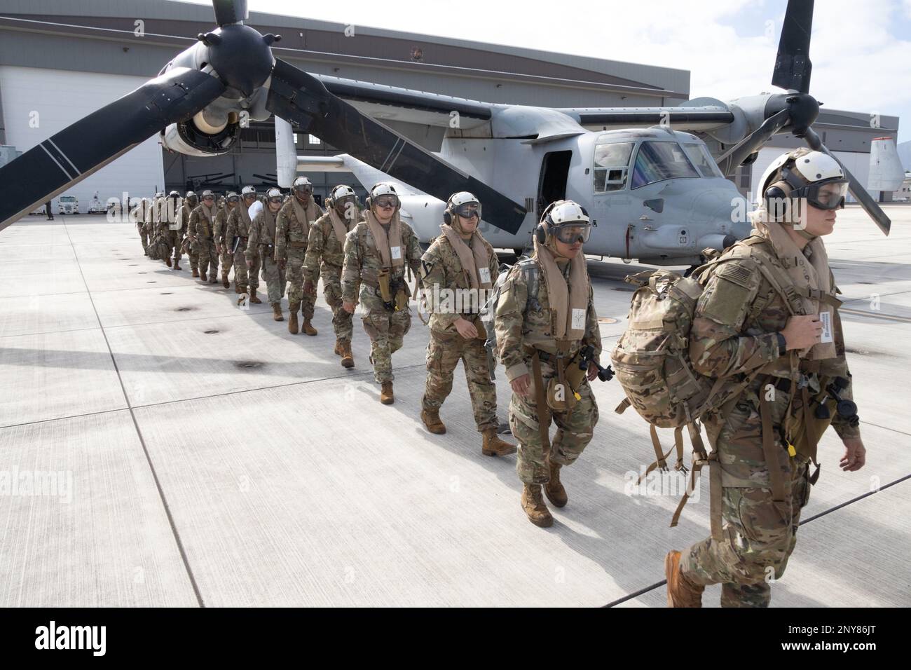 U.S. Army Soldiers with the 25th Infantry Division prepare to embark an ...