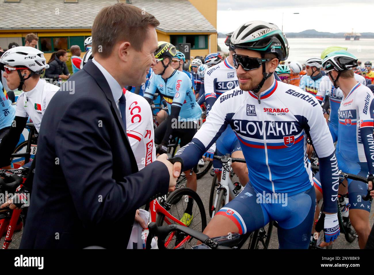 Slovakia's Peter Sagan, right, shakse hands with UCI president David ...