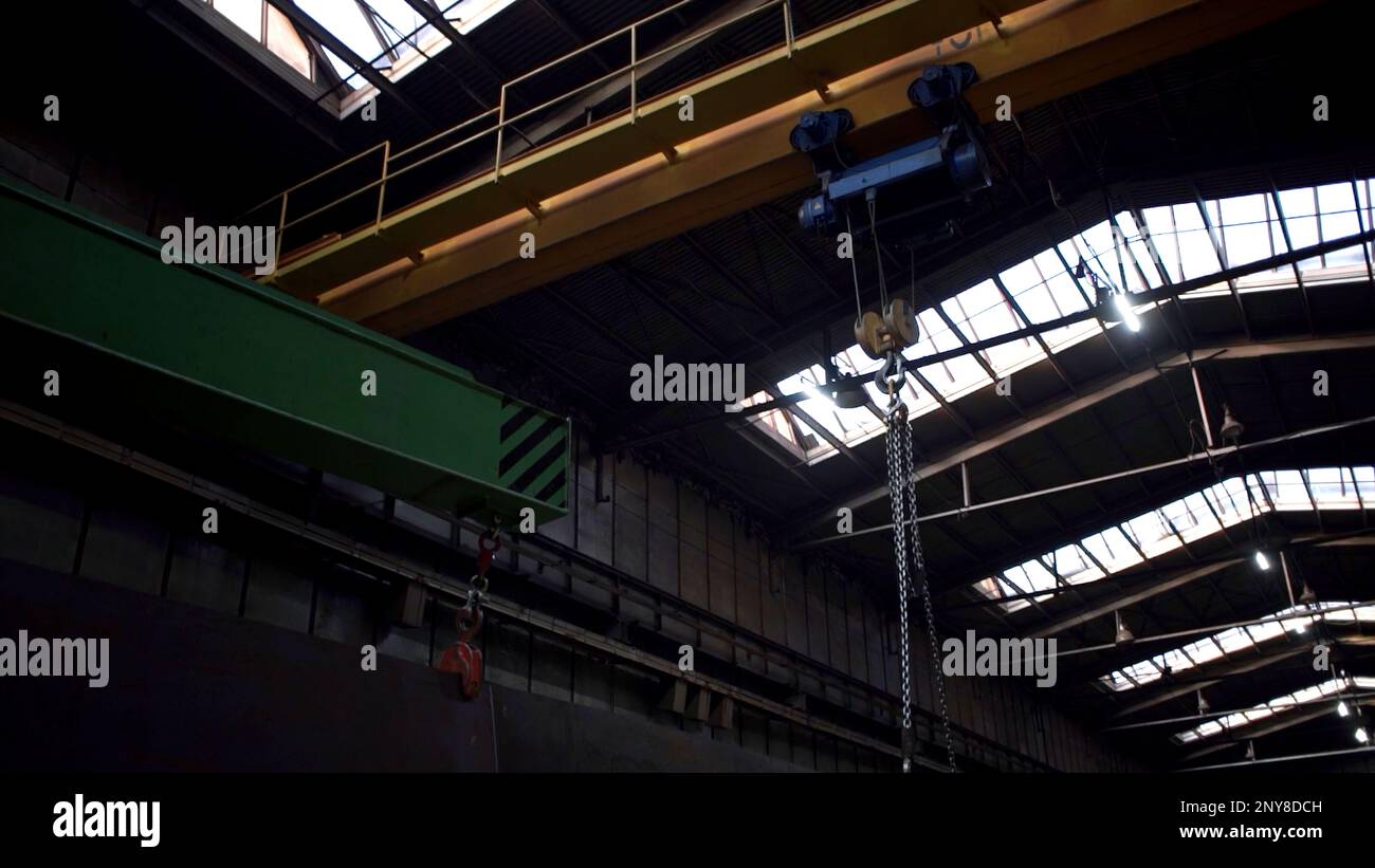 Large metal construction of an industrial crane transporting details ...