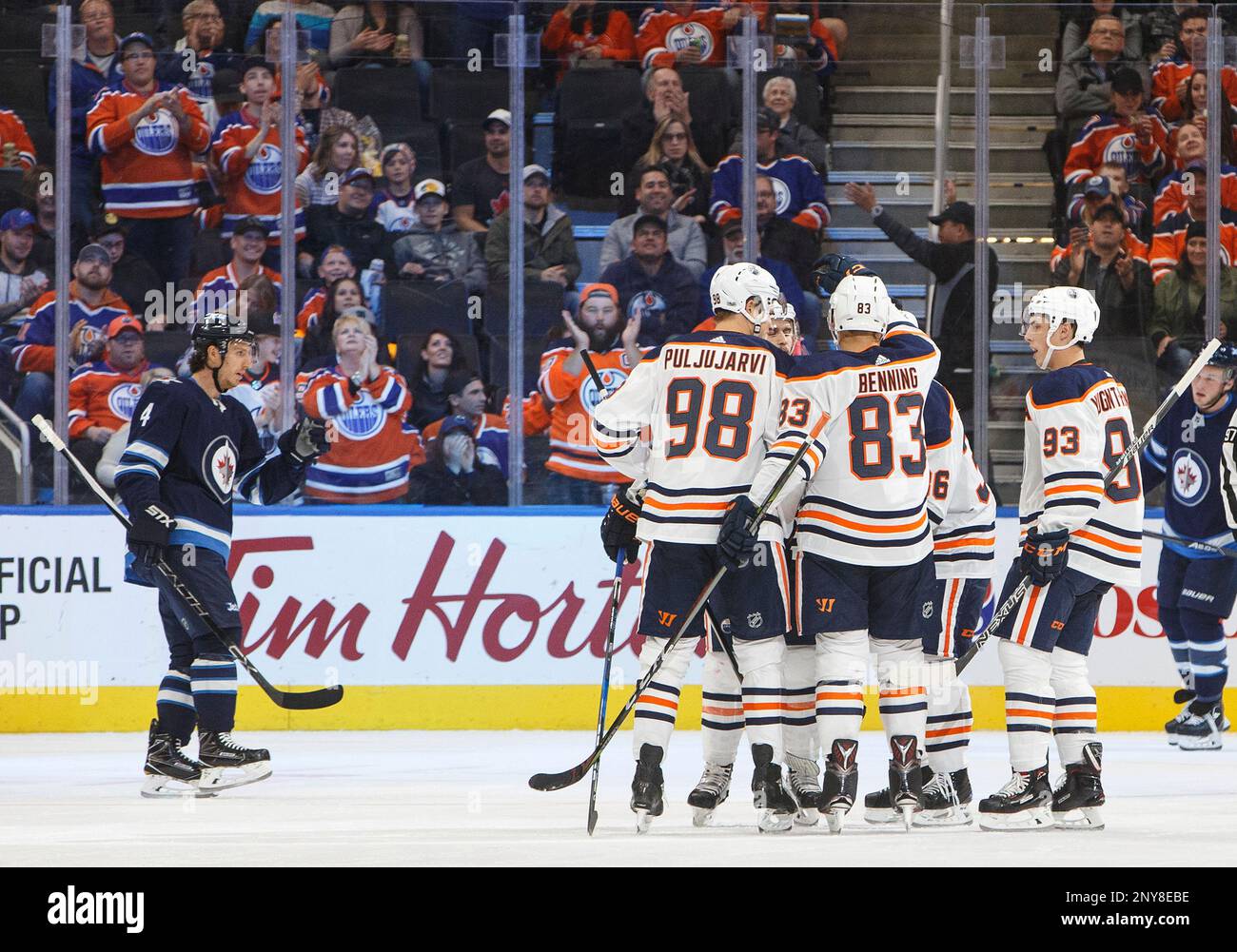 Winnipeg Jets' Michael Sgarbossa (4) skates past as the Edmonton Oilers ...