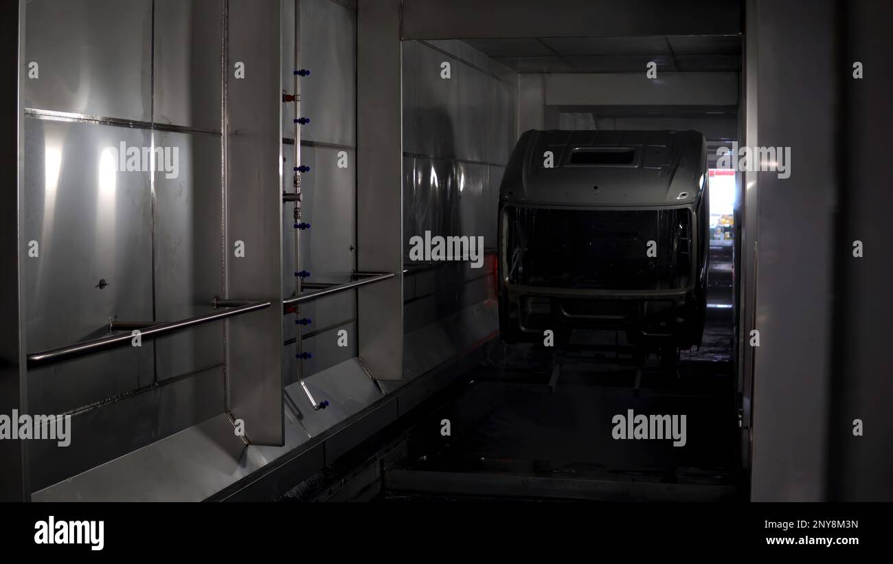 Large modern truck manufacturing plant interior. Scene. Parts of a ...