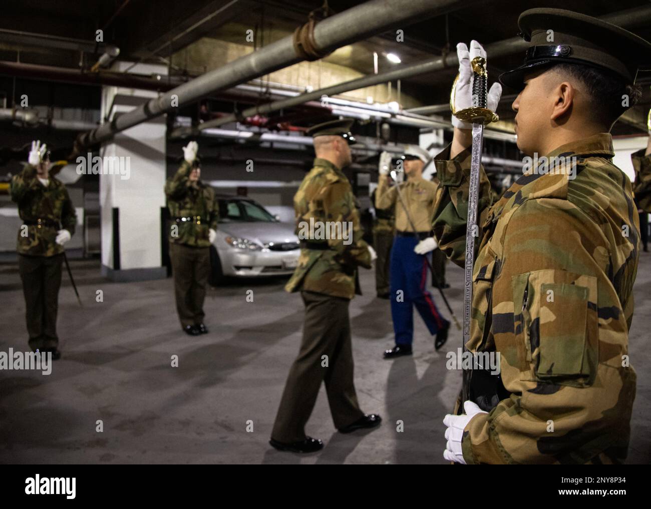 Corporal David Cruz, administrative clerk, executes return sword during ...