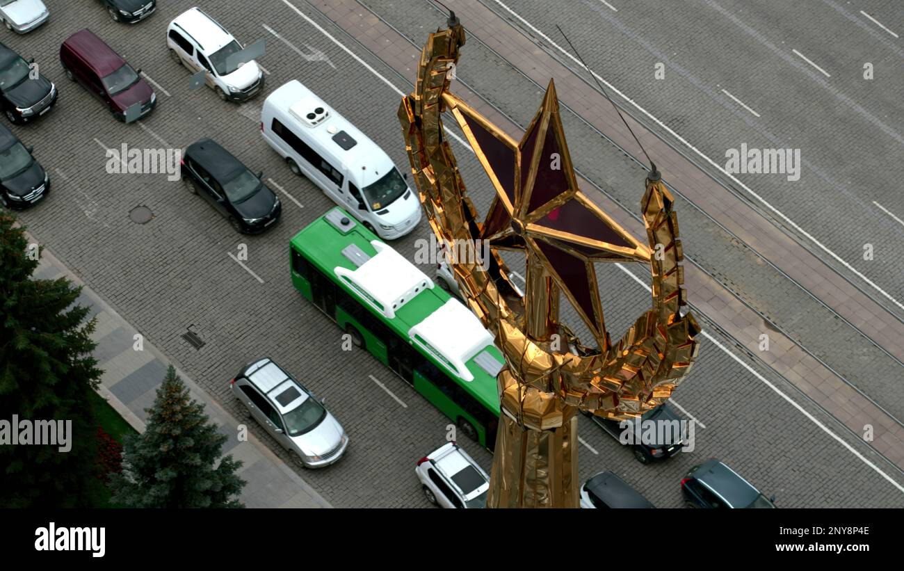 Soviet symbol, golden spire on the background of a street with moving ...