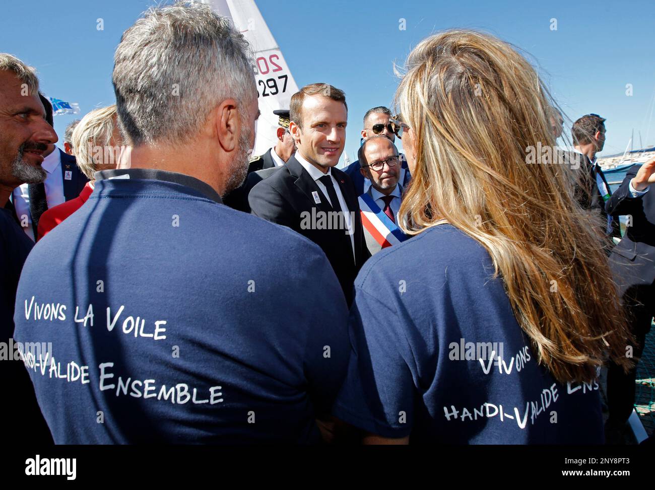 French President Emmanuel Macron speaks with athletes as he visits the ...