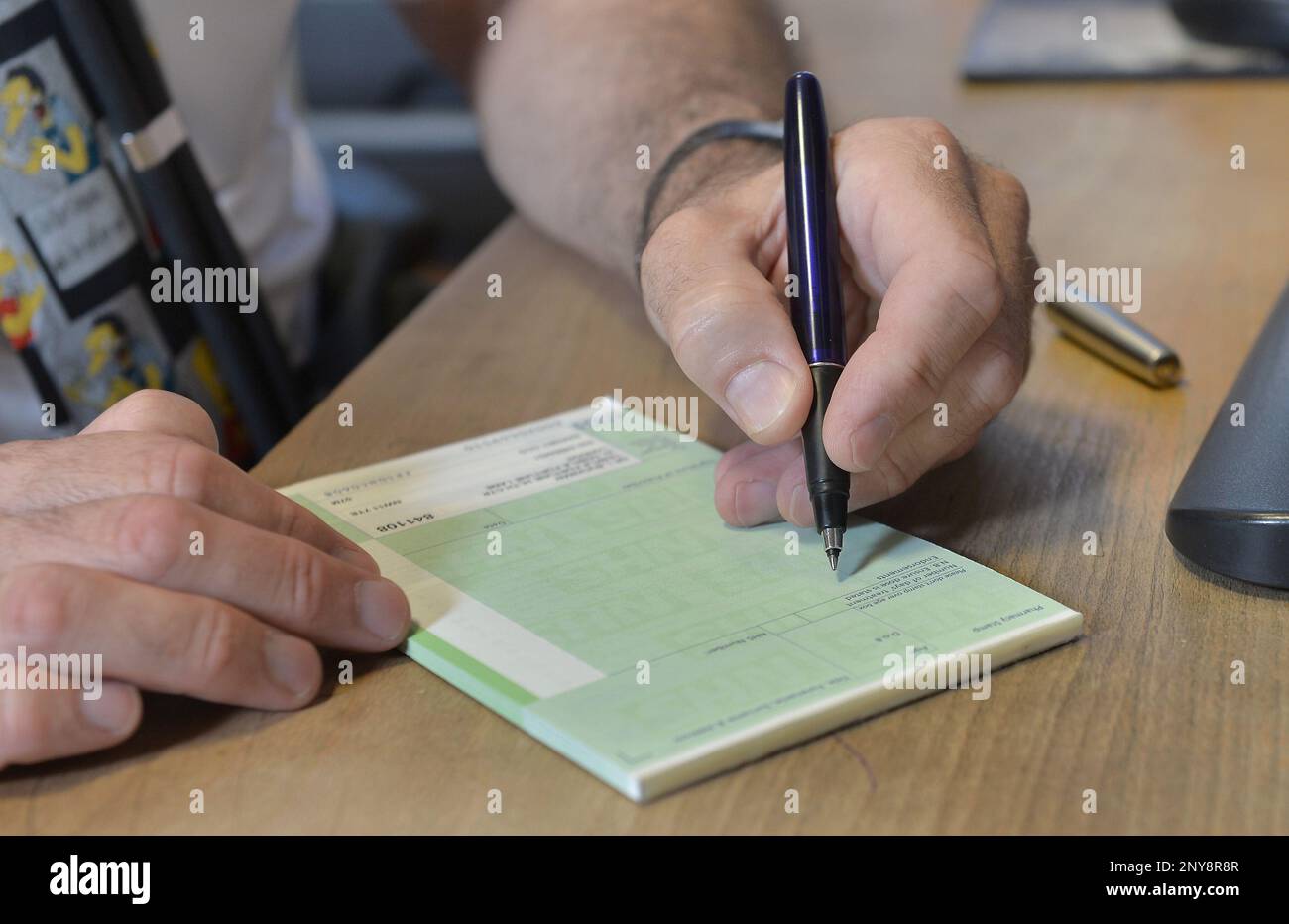 File photo dated 10/09/14 of a GP writing a prescription, as GPs and ...