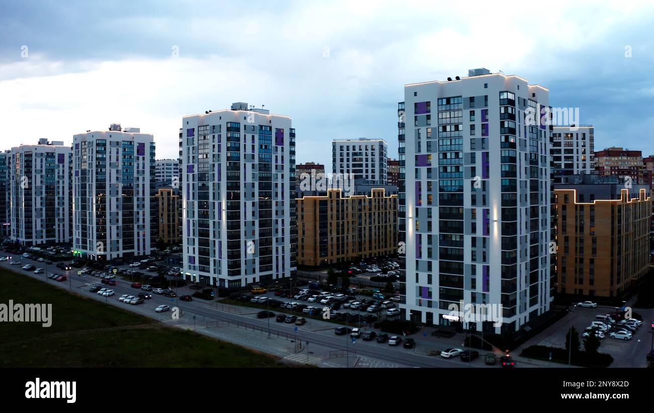 Aerial view of the evening city with high rise residential buildings ...