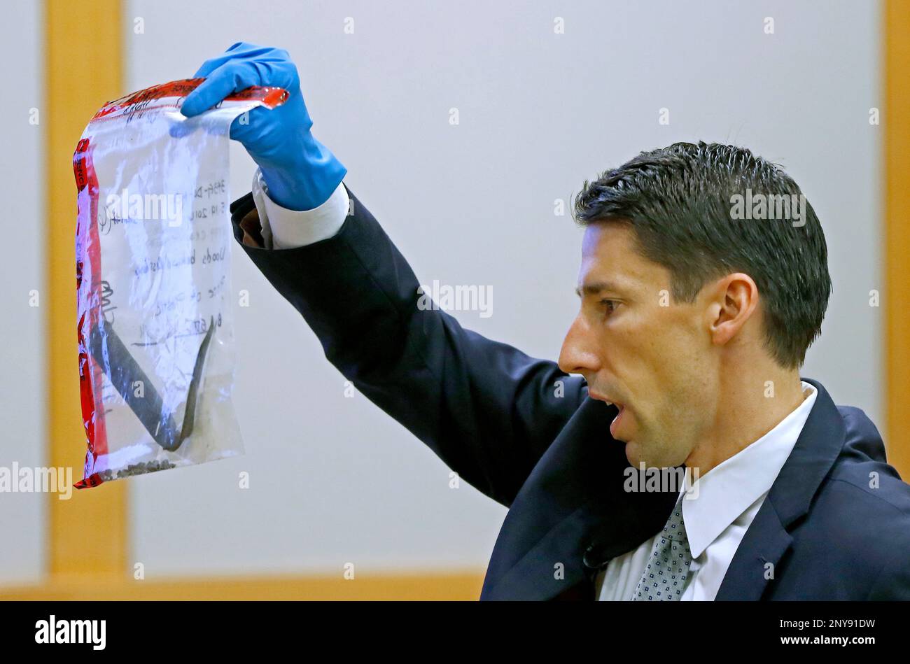 Prosecutor Wes Wynne shows jury an auto part during Jason Lowe's murder ...