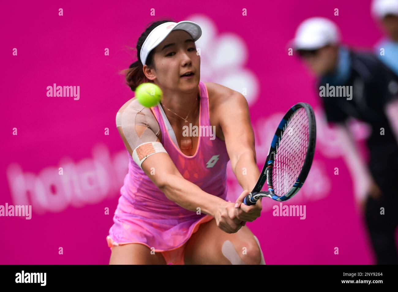Zhang Kailin of China returns a shot to Jana Fett of Croatia in their ...