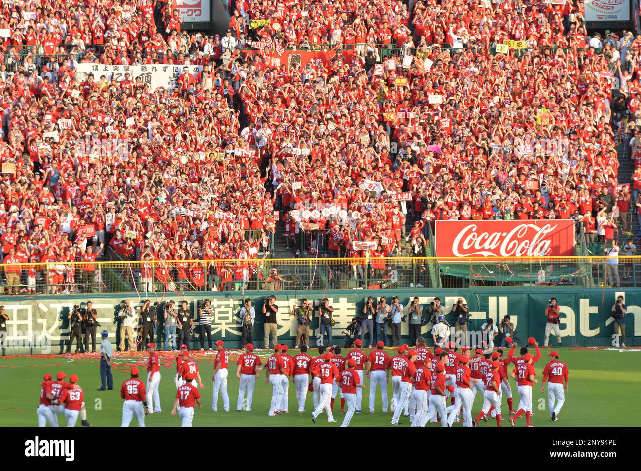Members of Hiroshima Toyo Carp celebrate after their team winning the ...