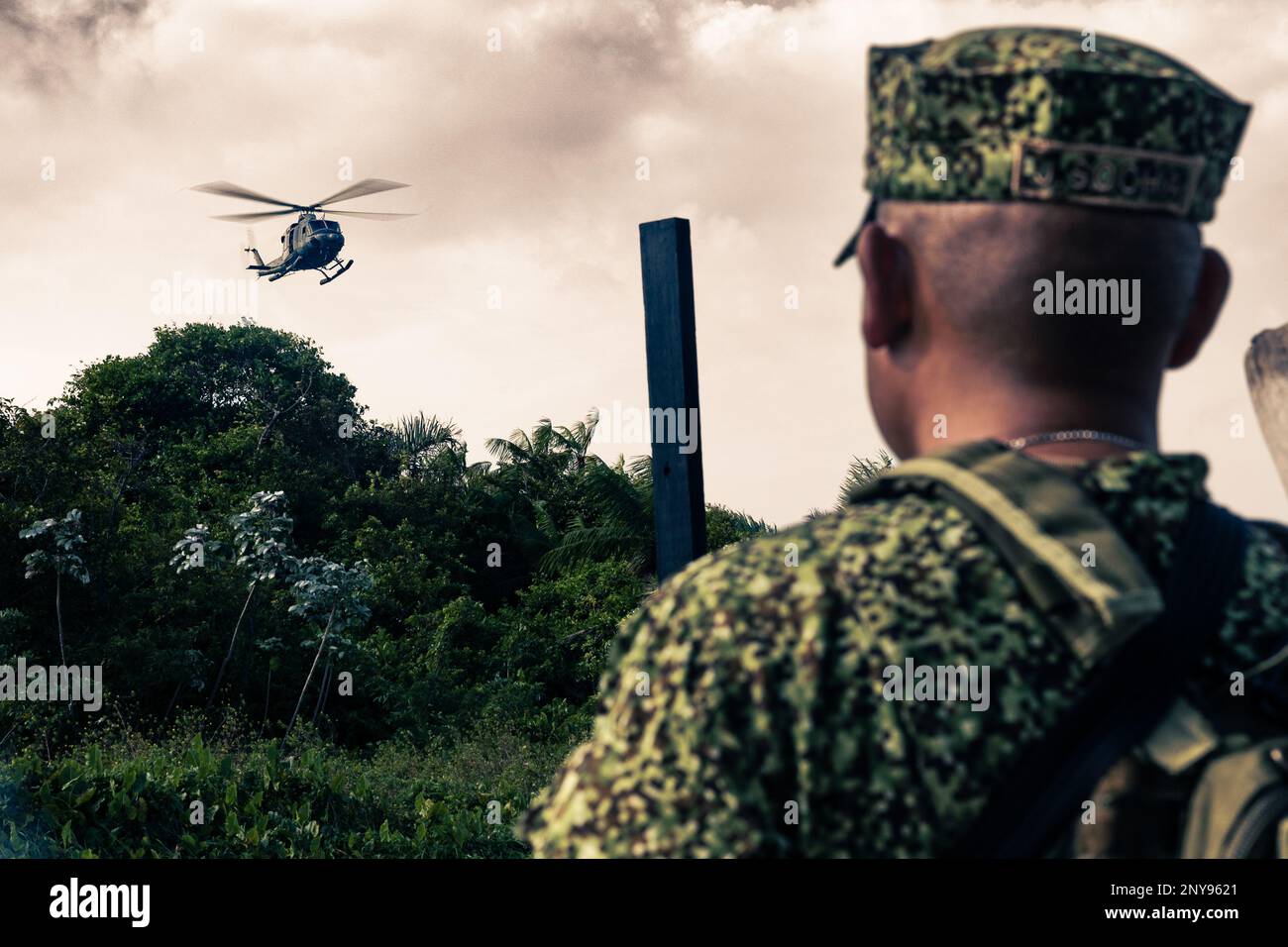 A Colombian Marine looks at an Armada Nacional de la Republica de ...