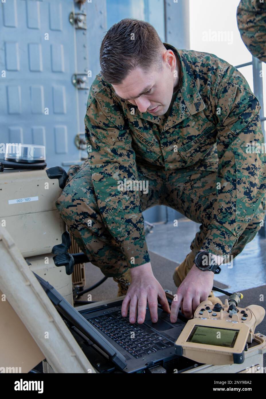 U.S. Marine Corps Cpl. Nathan Decker, a ground electronic transmission ...