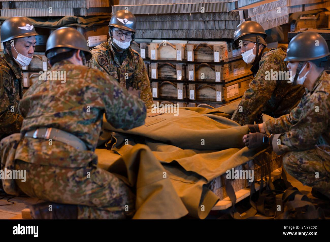 Soldiers from the Japan Ground Self-Defense Force build a bundle in ...