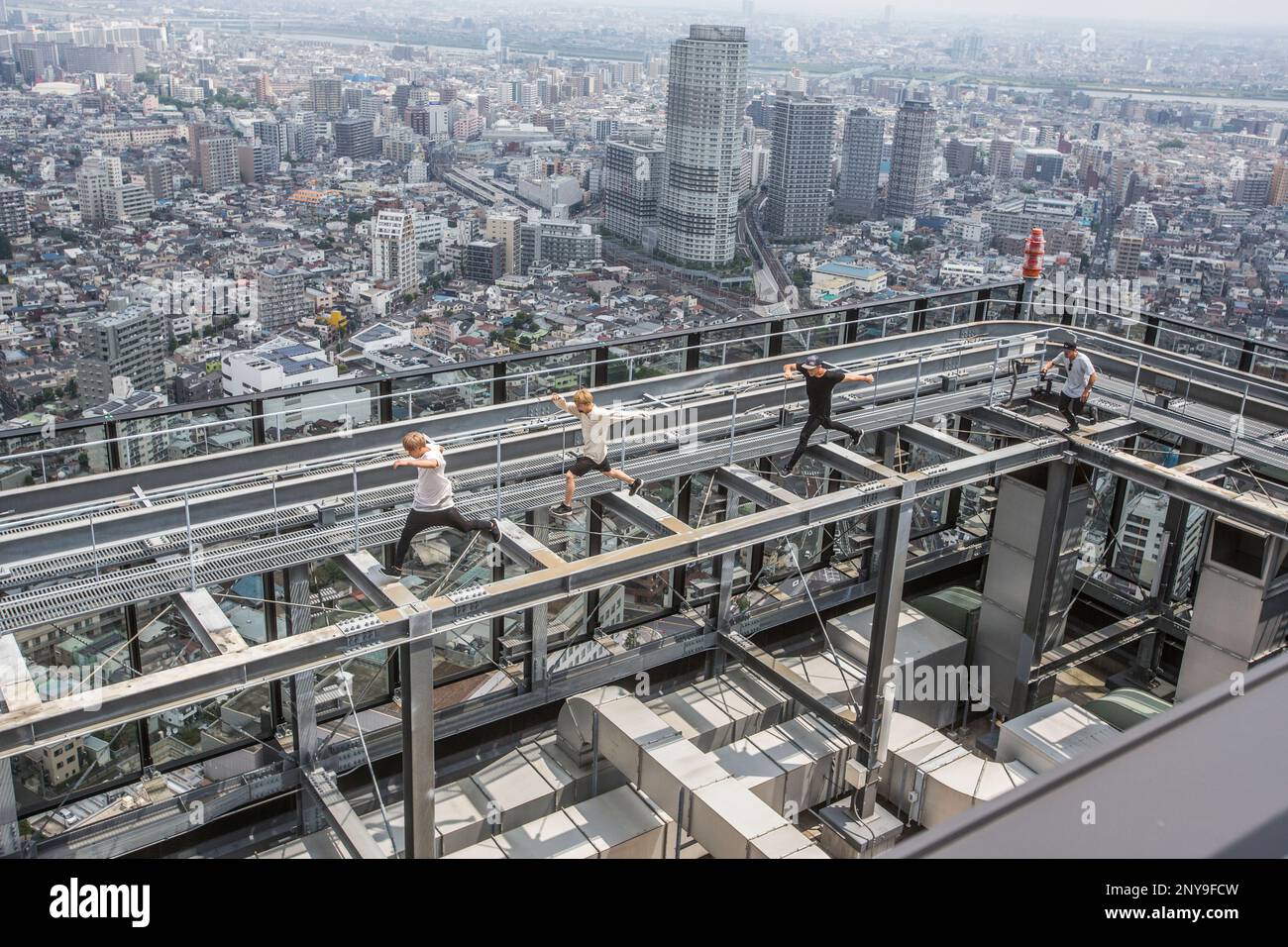 Zen Shimada, Kenichi Sato, and Jason Paul stride while freerunner ...