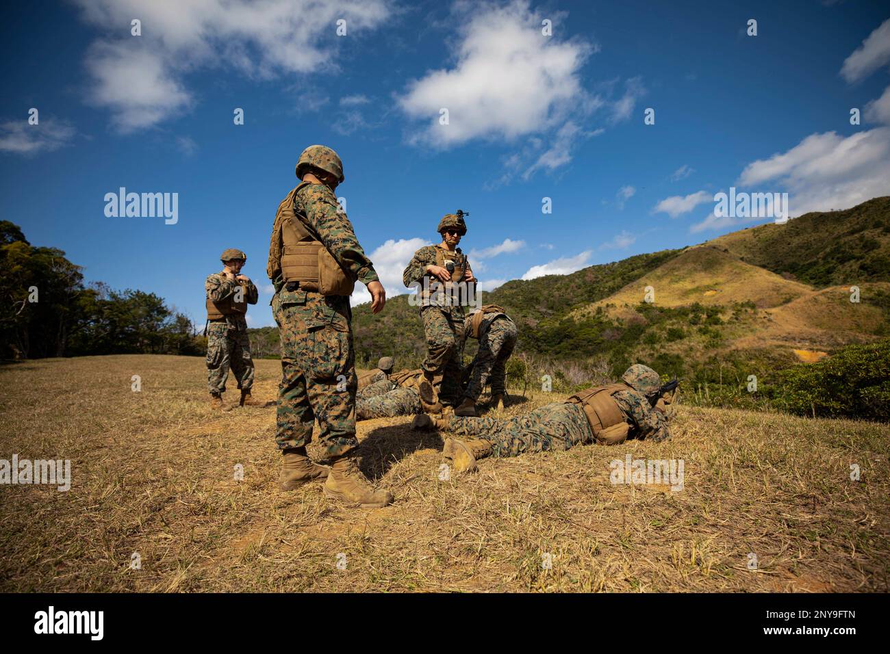 U.S. Marines with Combat Logistics Regiment 37 (CLR-37) fire weapons ...