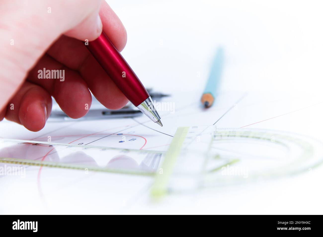 Professional architect working at his desk, measuring and estimating ...