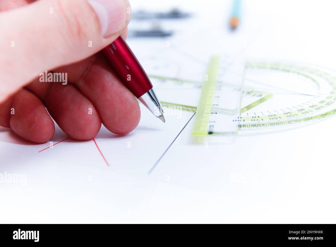 Professional architect working at his desk, measuring and estimating ...