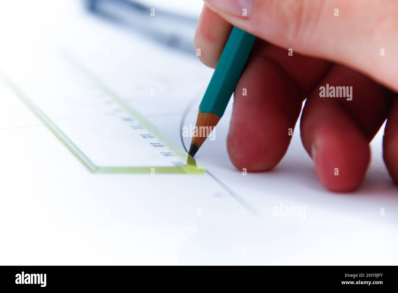 Professional architect working at his desk, measuring and estimating ...