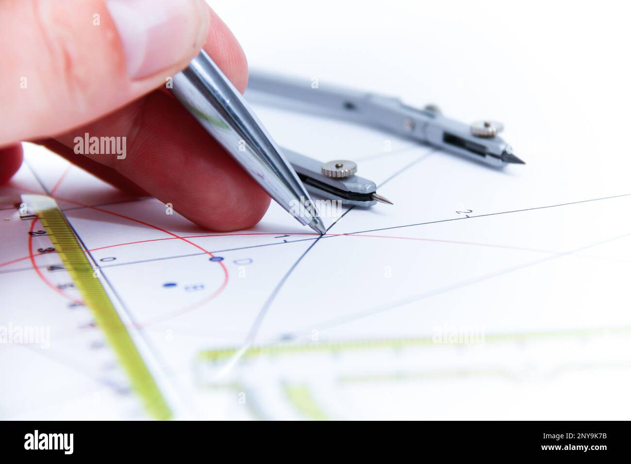 Professional architect working at his desk, measuring and estimating ...