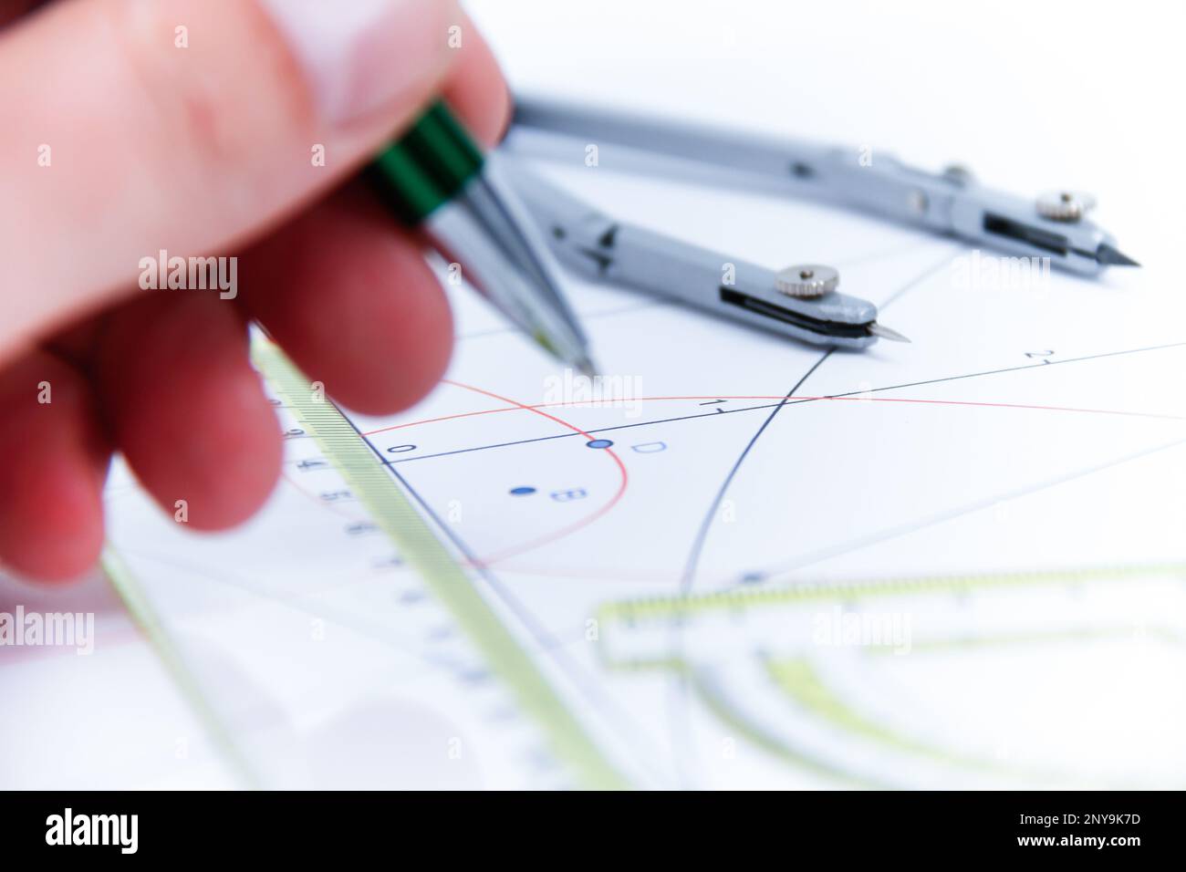 Professional architect working at his desk, measuring and estimating ...