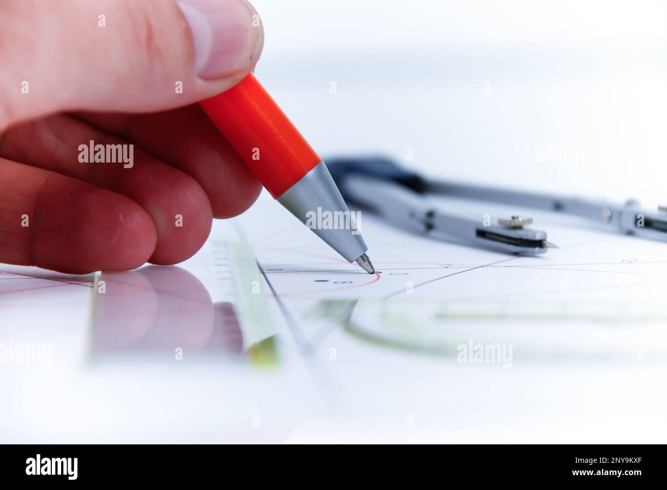 Professional architect working at his desk, measuring and estimating ...