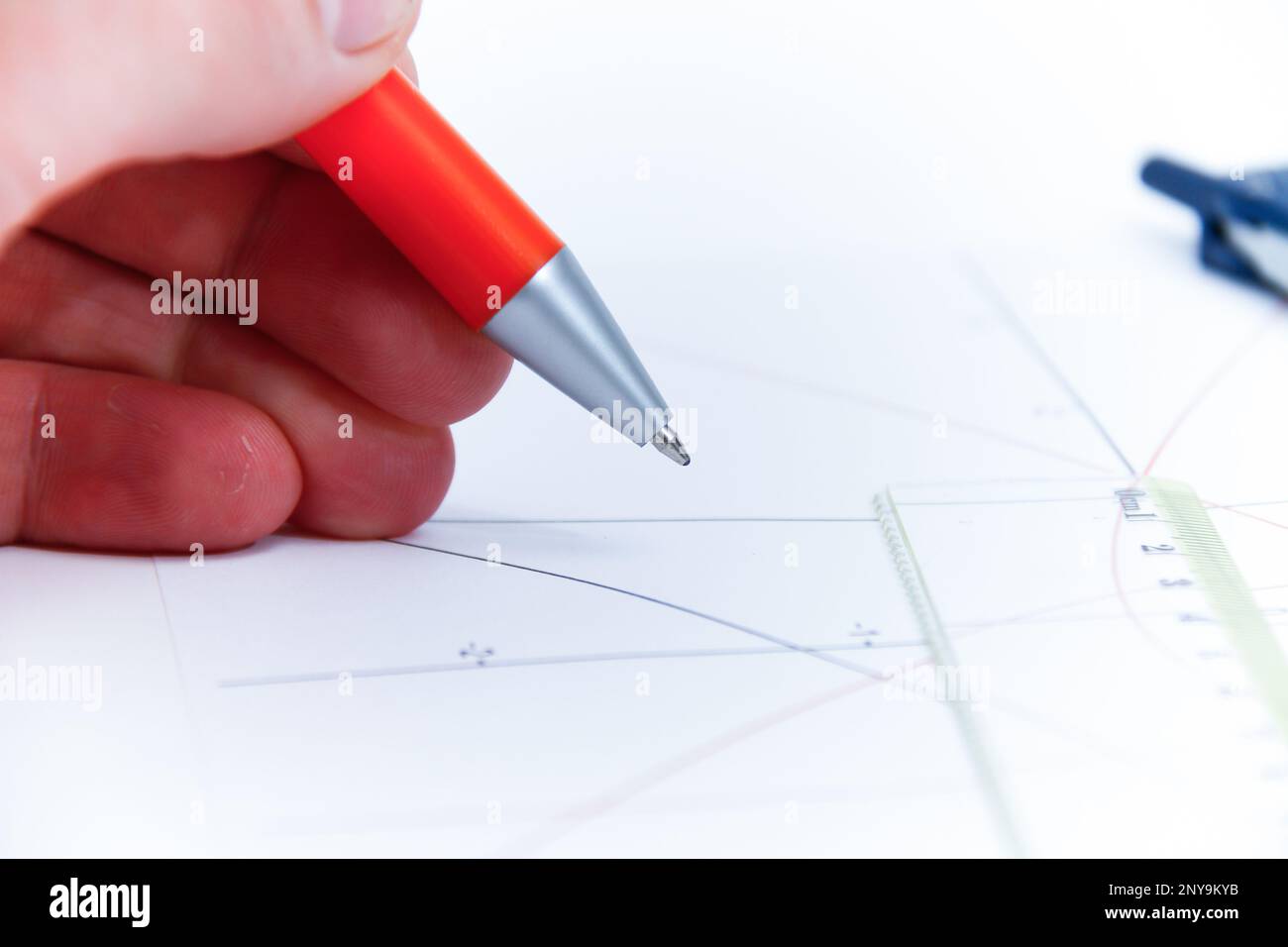 Professional architect working at his desk, measuring and estimating ...